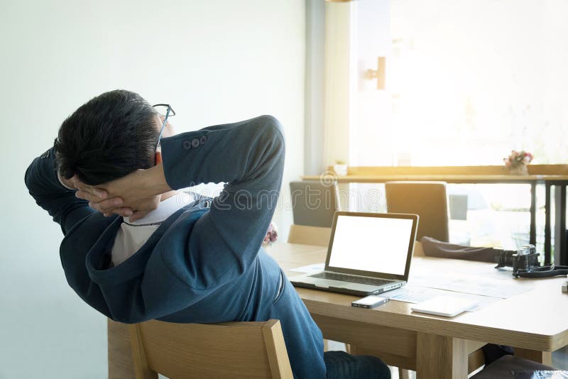 Young Business Man Having a Little Rest after Work in Office Stock ...