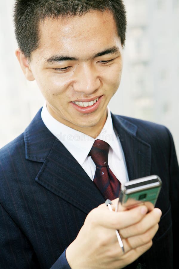 Young Business Man Holding Mobile Phone Stock Image - Image of career ...