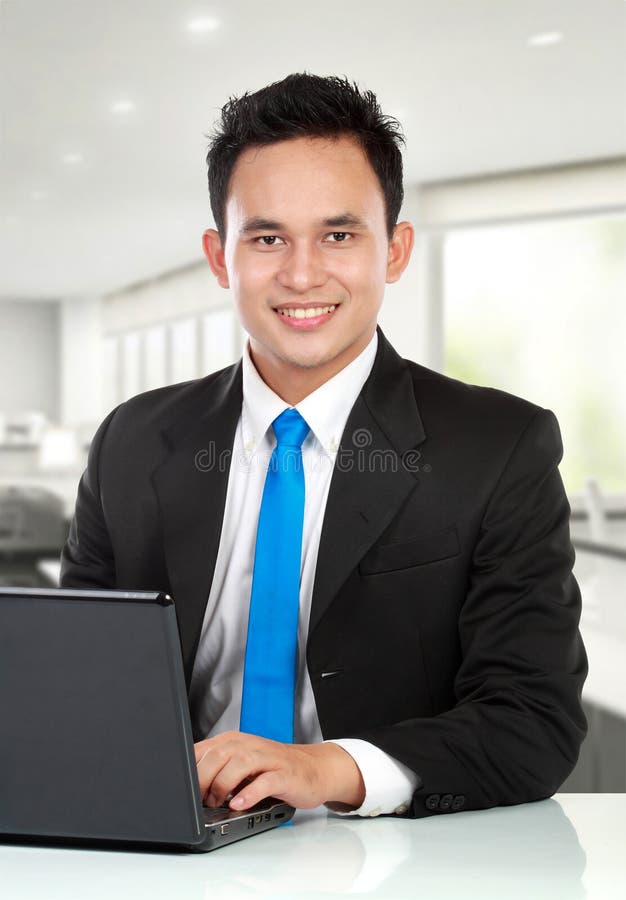 Young Business Man with a Laptop Stock Photo - Image of male, smile ...
