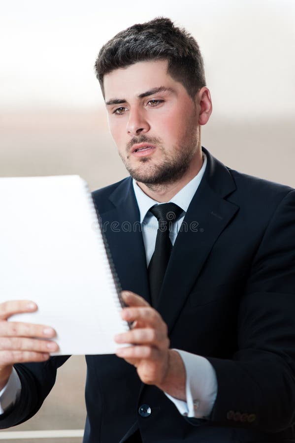 Young Business Man Looking at Flip Chart Stock Image - Image of office ...