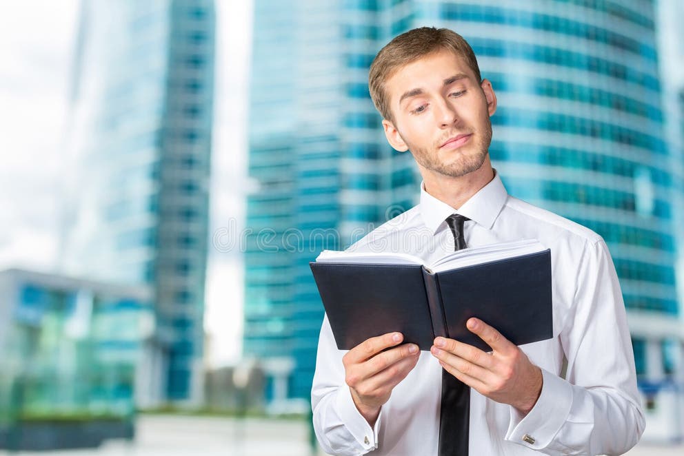 Young Business Man Reading a Book Stock Image - Image of occupation ...