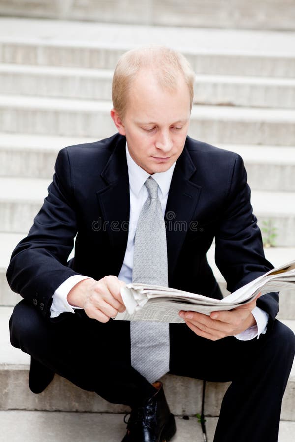 Young Business Man is Reading Newspaper Outdoor Stock Photo - Image of ...