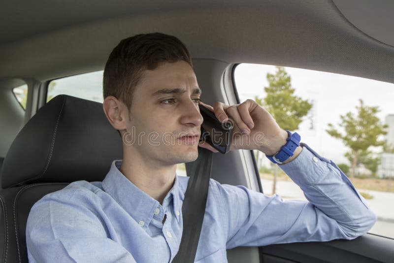 Young Business Man Speaking on His Phone Inside Car Stock Image - Image ...