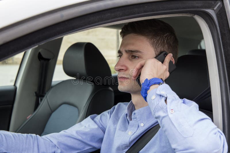 Young Business Man Speaking on His Phone Inside Car Stock Image - Image ...