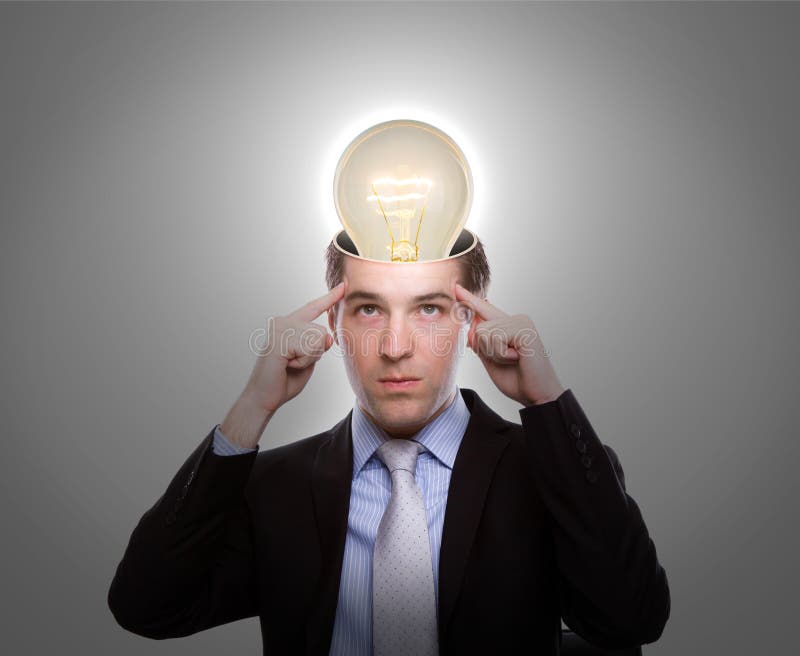 Young Business Man Thinking with Light Bulb Stock Photo - Image of ...