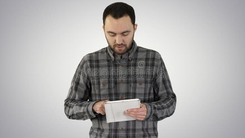 Young Business Man Using His Tab Walking on Gradient Background. Stock ...