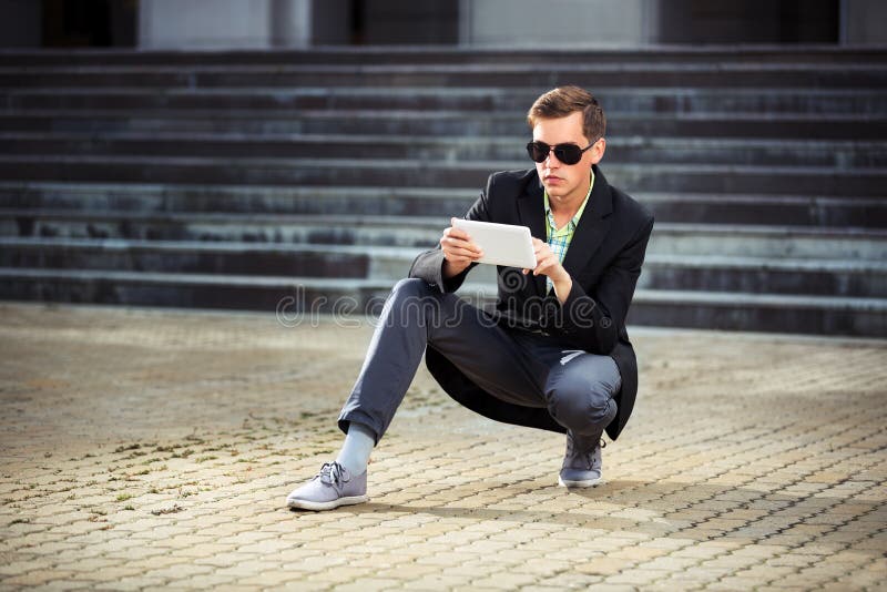 Young Business Man Using a Tablet Computer Outdoor Stock Photo - Image ...
