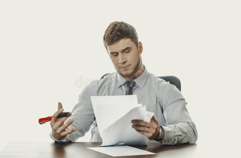 Young Business Man Viewing Documents. Stock Image - Image of important ...
