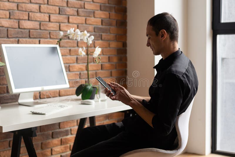 Young Business Man Working at Home with Laptop on Desk Stock Image ...