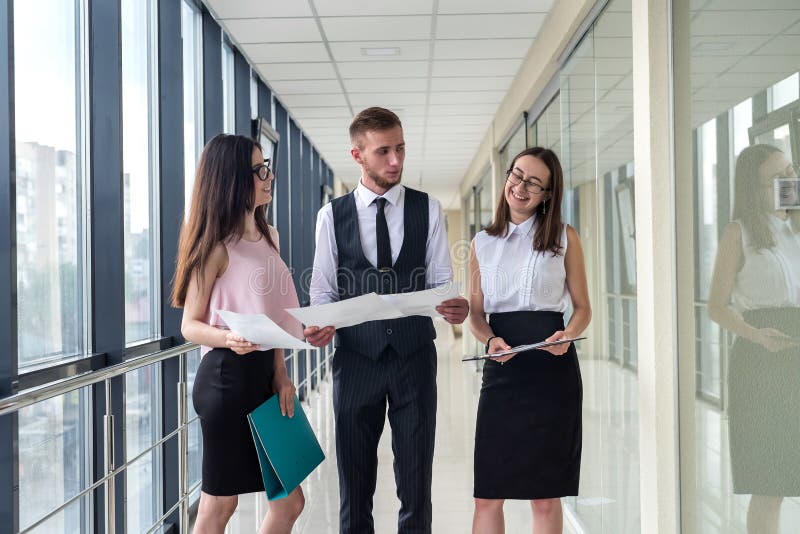 Young Business Partners Discuss the Layout of a Modern House Stock ...