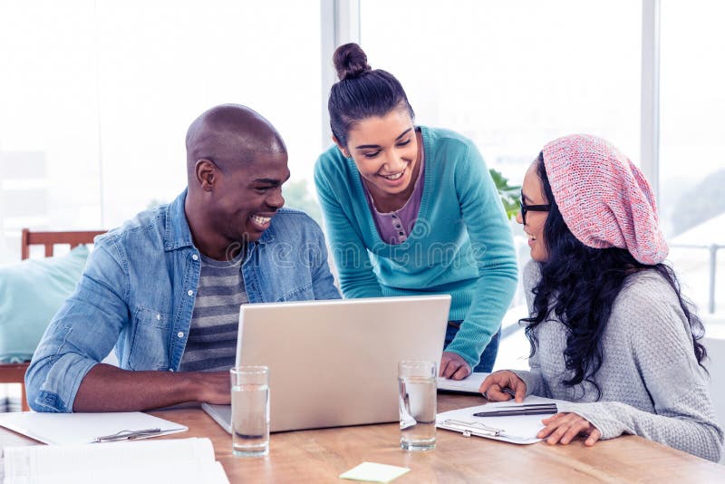 Two Black Business People Working on a Laptop while Drinking Coffee in ...