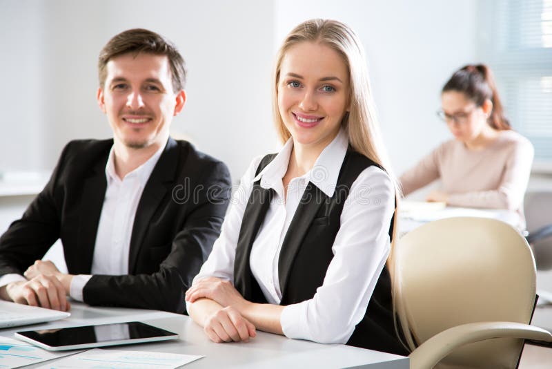 Young Business People are Looking at the Camera Smiling Stock Image ...