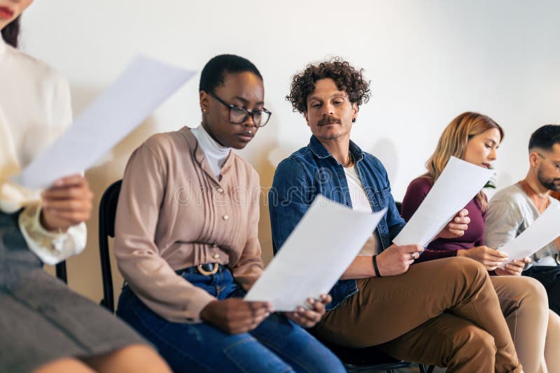 Young Business People Sitting in Chairs and Waiting for an Interview ...