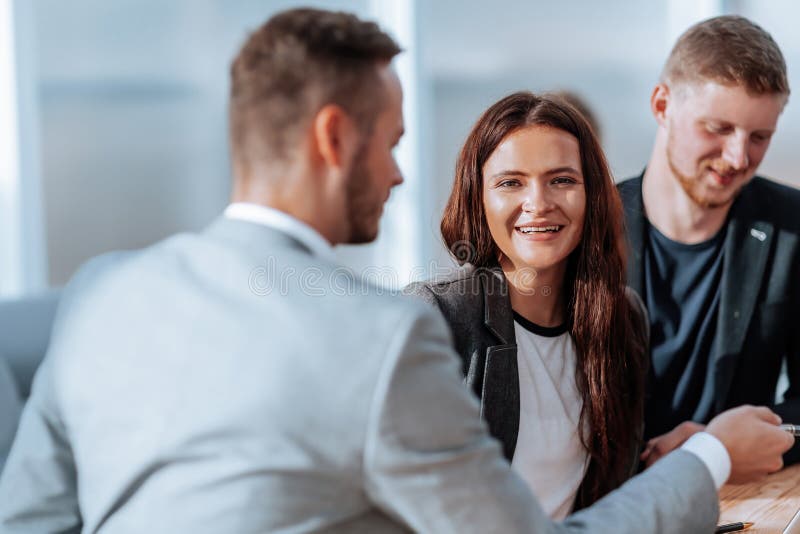 Young Business People Sitting at the Office Desk Stock Photo - Image of ...