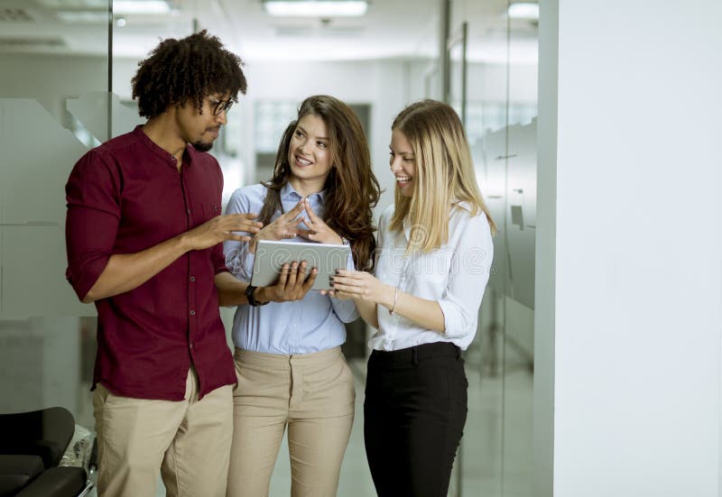 Young Business People with Tablet in Office Stock Image - Image of team ...