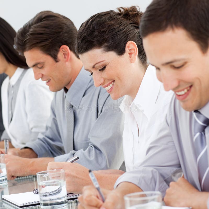 Young Business People Taking Notes at a Conference Stock Photo - Image ...