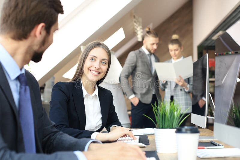 Young Business People Working on Their Desktop Computers at the Modern ...