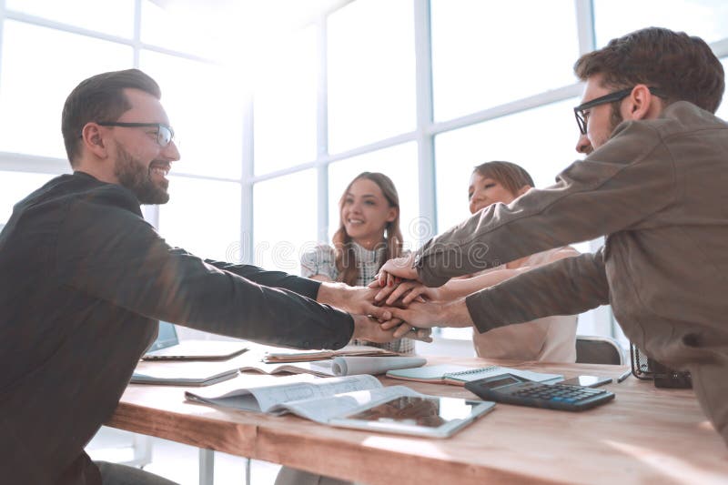Young Business Team Putting Their Hands Together Stock Photo - Image of ...