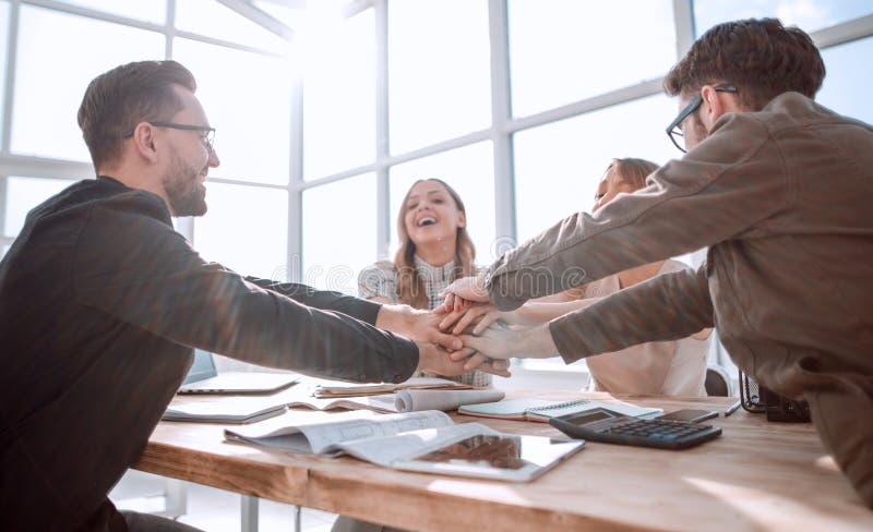 Young Business Team Putting Their Hands Together Stock Image - Image of ...