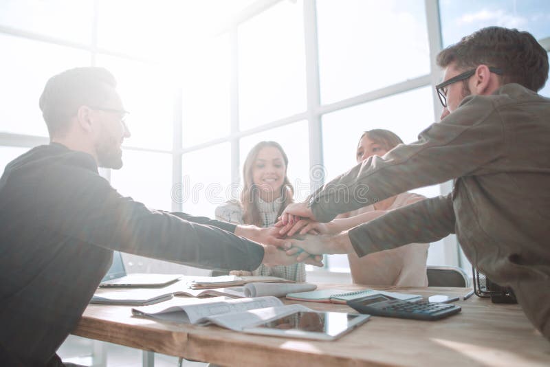 Young Business Team Putting Their Hands Together Stock Photo - Image of ... Young Business Team Putting Their Hands Together Stock Photo - Image of ...