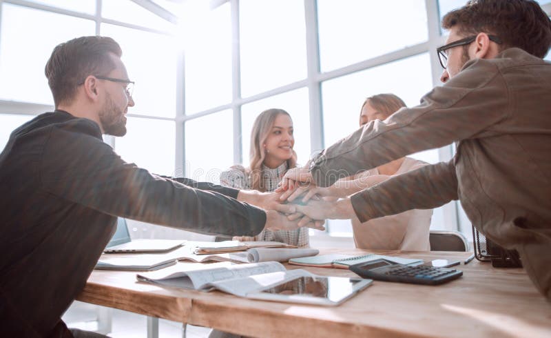 Young Business Team Putting Their Hands Together Stock Photo - Image of ... Young Business Team Putting Their Hands Together Stock Photo - Image of ...