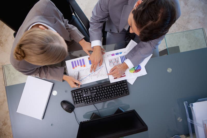 Young Business Team Studying Statistics Stock Photo - Image of board ...