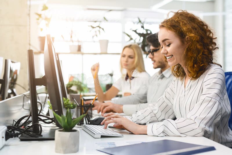 Young Business Team Working on Computers in Modern Office Stock Photo ...