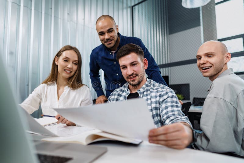 Young Business Team Working on a Project in Office. Stock Photo - Image ...