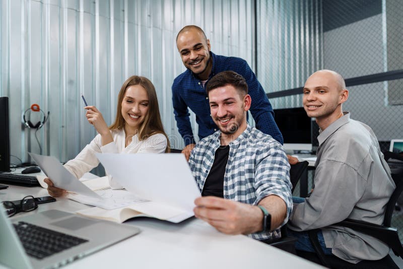 Young Business Team Working on a Project in Office. Stock Photo - Image ...