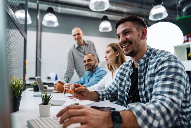 Young Business Team Working on a Project in Office. Stock Image - Image ...