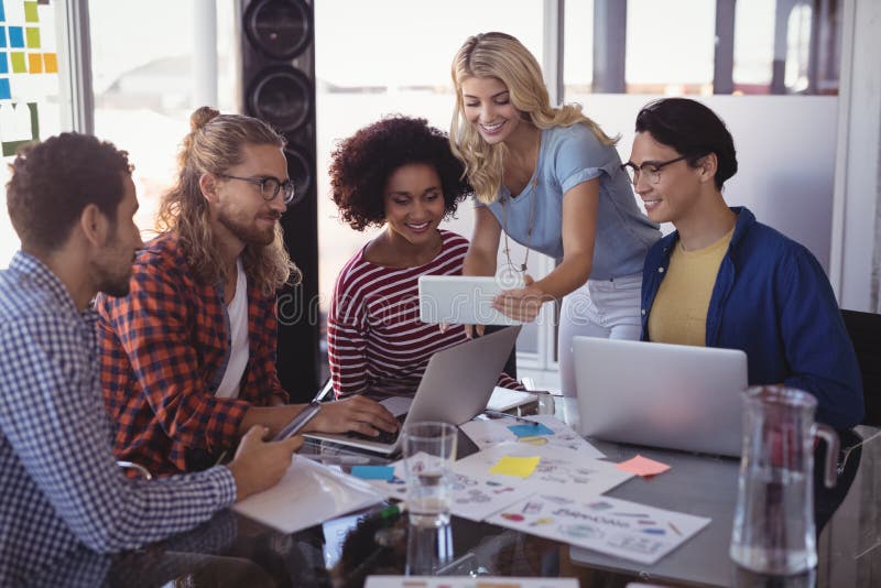 Young Business Team Working Together at Desk Stock Photo - Image of ...