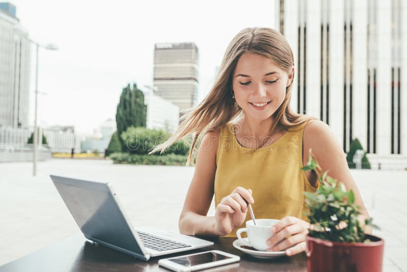 Young Business Woman on the Computer Drinking a Coffee Stock Photo ...