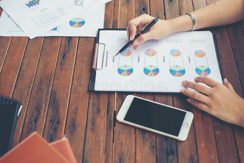 Young Business Woman Hands Analysis with Business Chart on Workplace ...