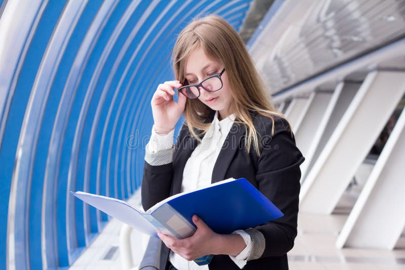 Young Business Woman Reading Documents Folder Stock Photo - Image of ...