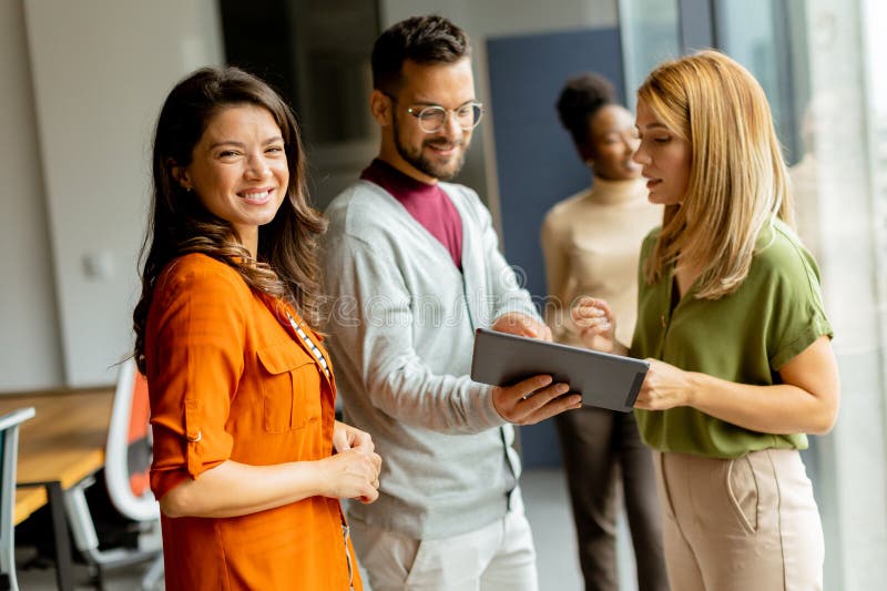 Young Business Woman Standing in Front of Her Team at the Office Stock ...