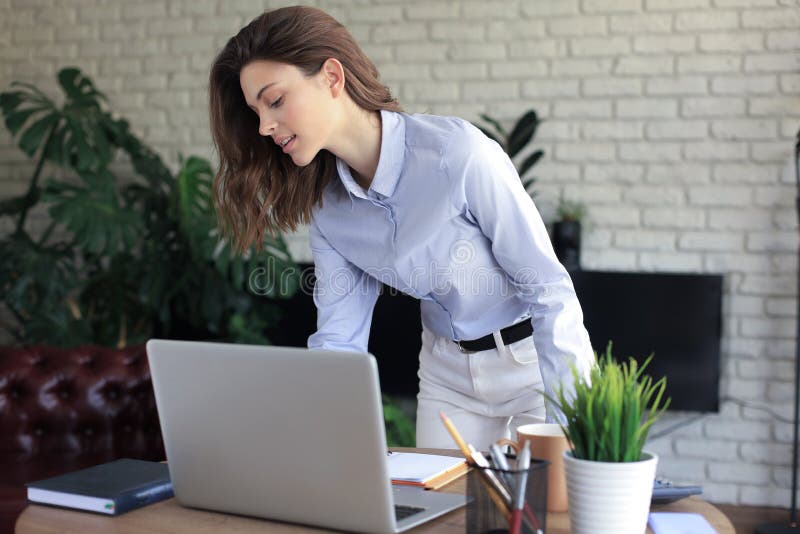Young Business Woman Standing in Her Home Office Reading Notes Stock ...