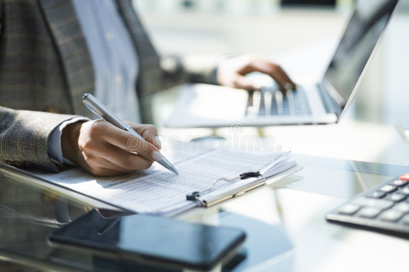 Young Business Woman Typing Computer Laptop with Graph Chart for Work ...