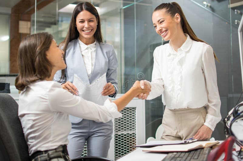 Young Business Women Shaking Hands in Office. Stock Photo - Image of ...