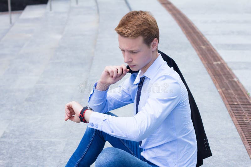 Young Businessman Angry Looking at the Clock and Waiting for the Client ...