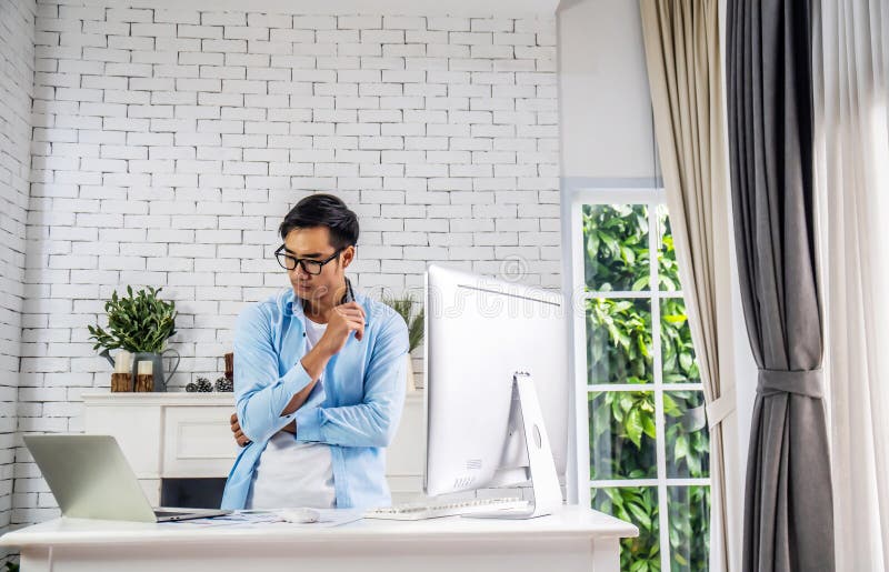 Young Businessman Asian Man Looking at Laptop Pondering Over Problem ...