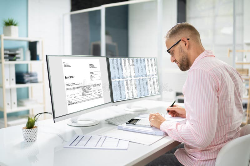 Young Businessman Calculating Invoice on Computer Screen Stock Image ...