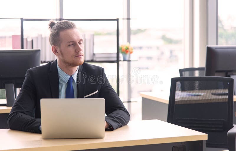 Young Businessman Closing Eyes for Take a Rest from Hard Work Stock ...