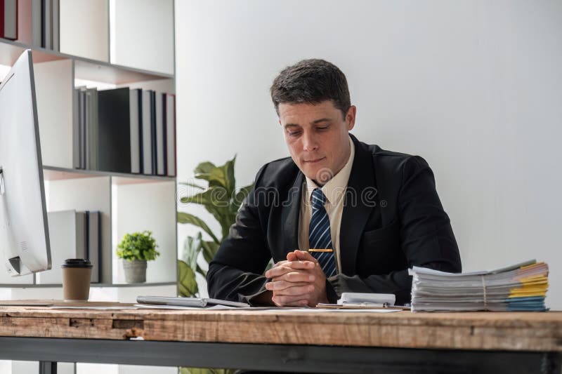 Young Businessman Looking Disappointed at Work, Sitting at Desk with ...