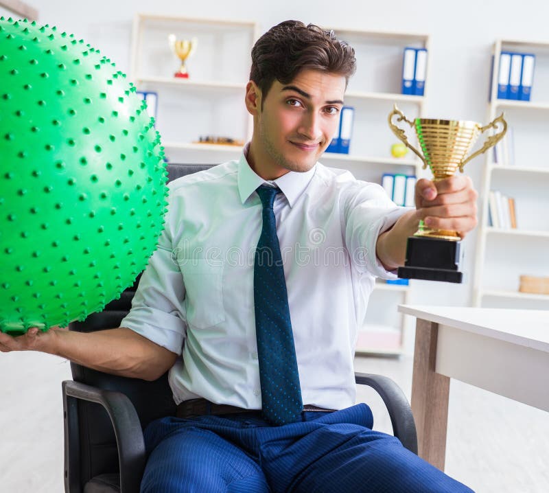 Young Businessman Doing Sports Stretching at Workplace Stock Image ...