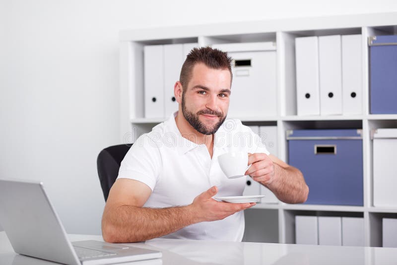 Young Businessman Drinking Coffee Stock Image - Image of drink, office ...