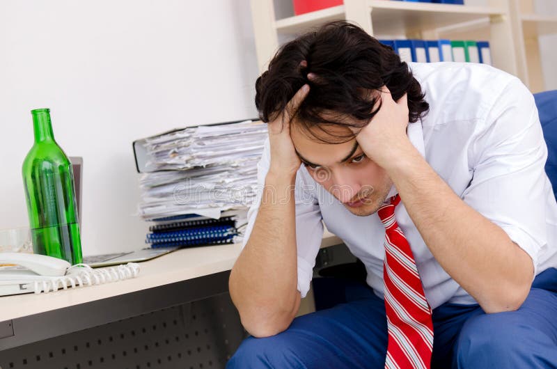 Young Businessman Employee Drinking in the Office Stock Image - Image ...