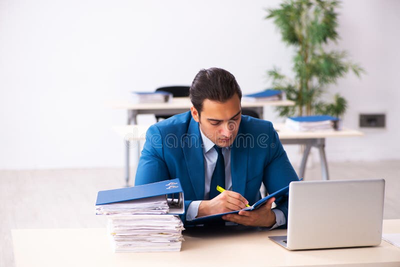 Young Businessman Employee Taking Notes in the Office Stock Photo ...