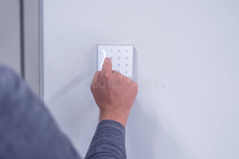 Young Businessman Entering Access Code at Building Entrance. the Smart ...