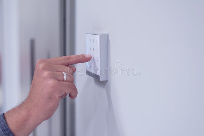 Young Businessman Entering Access Code at Building Entrance. the Smart ...