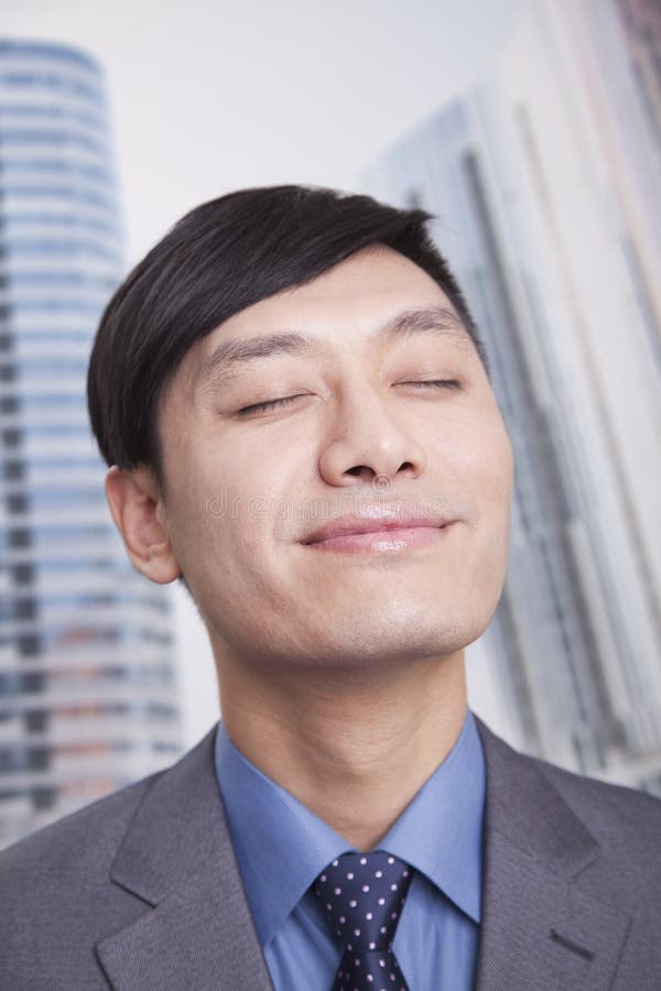 Young Businessman with Eyes Closed and Head Back Smiling, Portrait ...